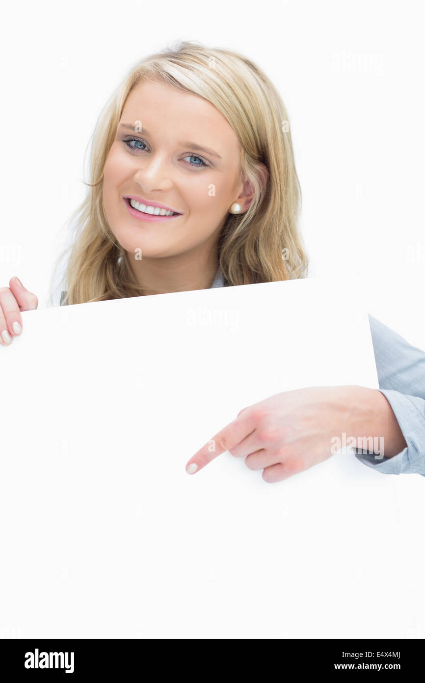 Smiling woman pointing on the paper Stock Photo - Alamy
