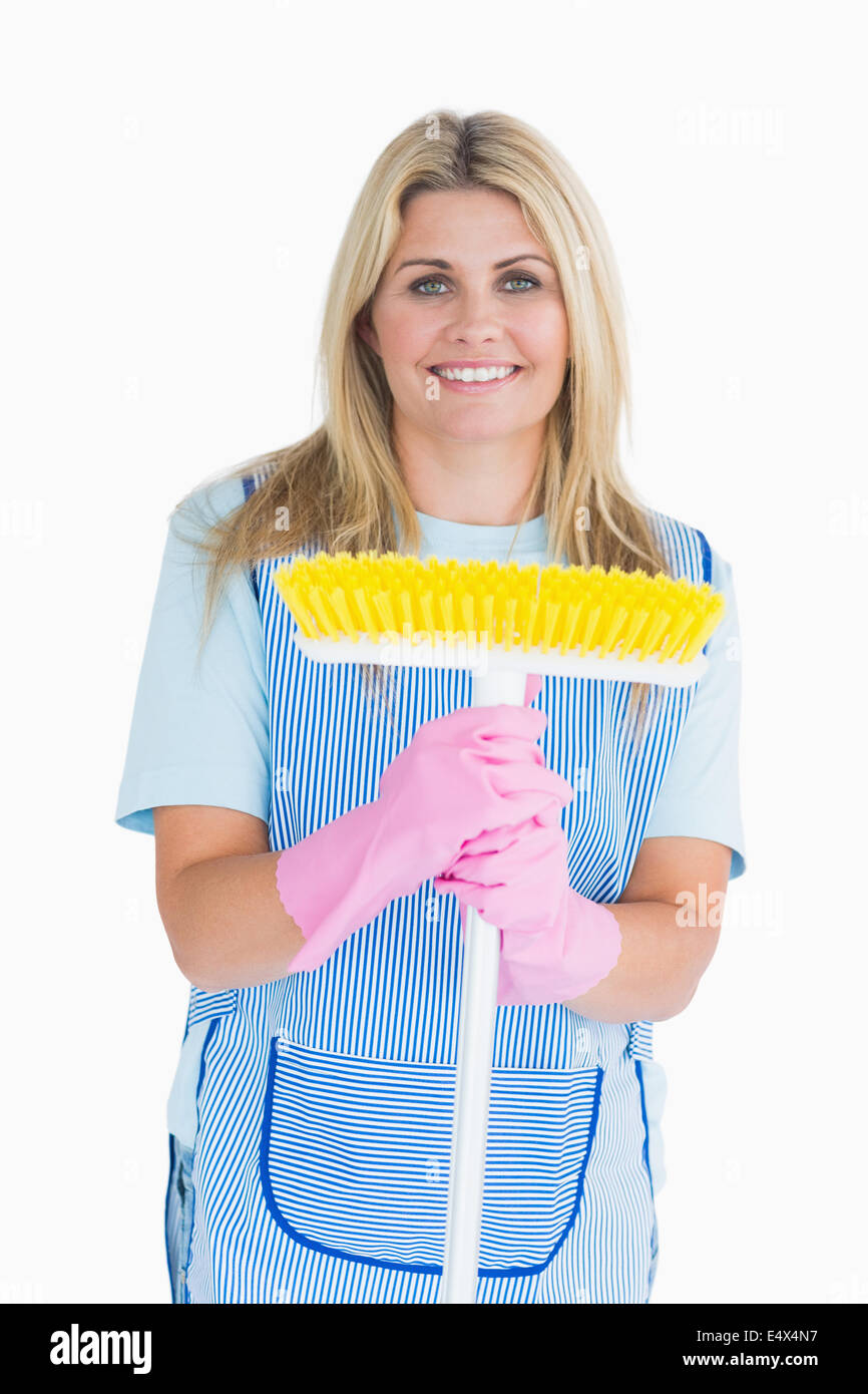 Cleaner woman holding a broom Stock Photo - Alamy