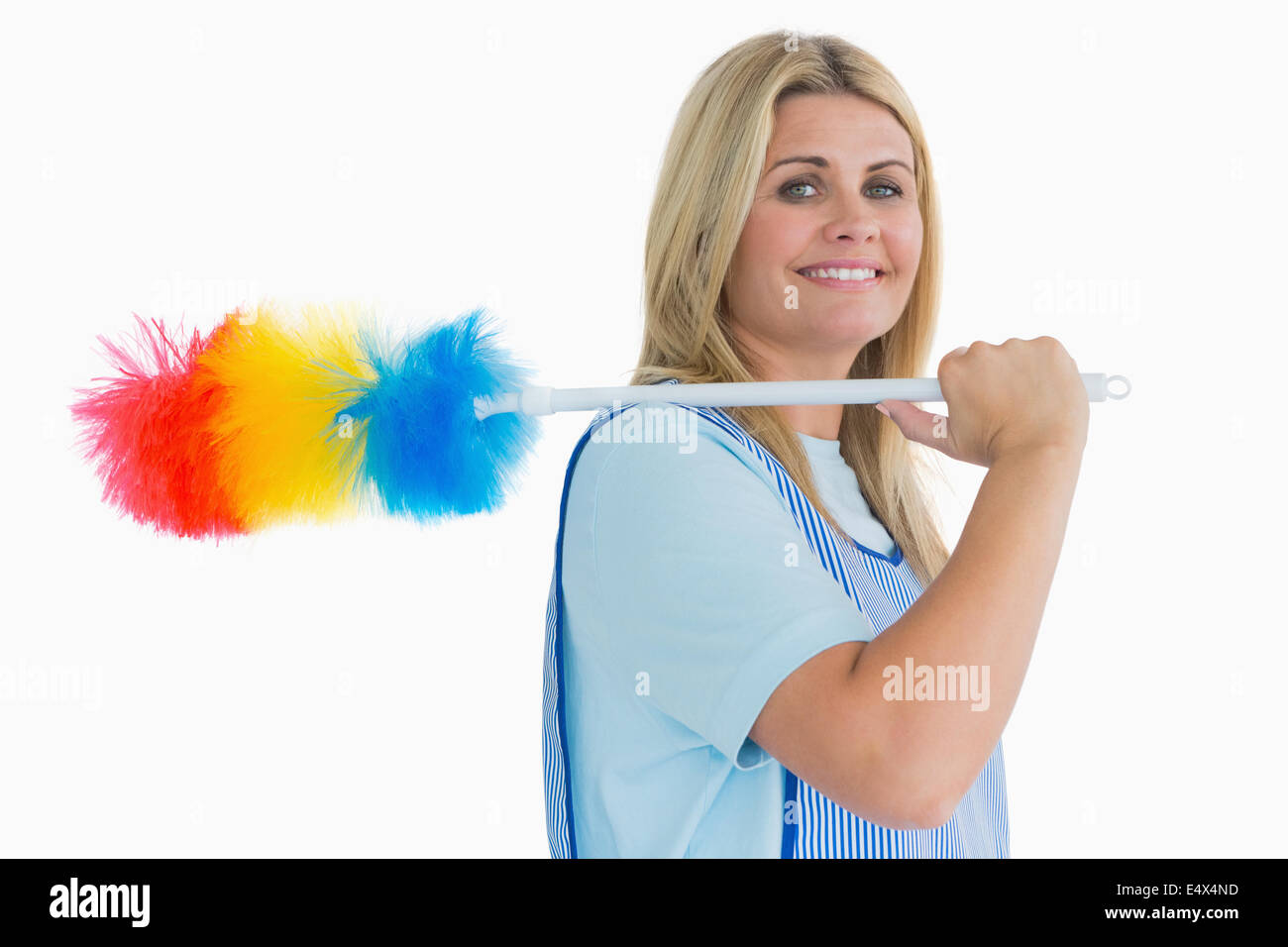 Smiling cleaning woman holding feather duster Stock Photo - Alamy