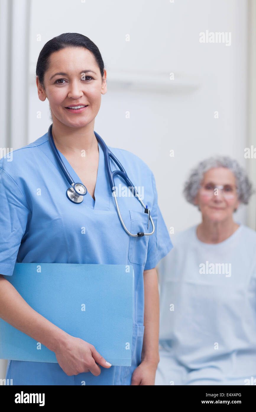 Nurse holding a folder Stock Photo - Alamy