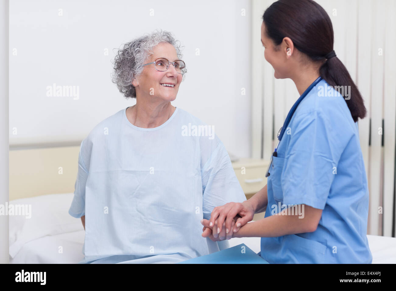 Nurse comforting a patient Stock Photo - Alamy