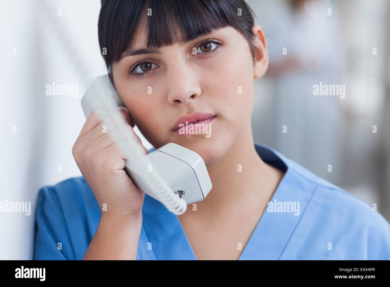 Nurse holding a phone Stock Photo - Alamy
