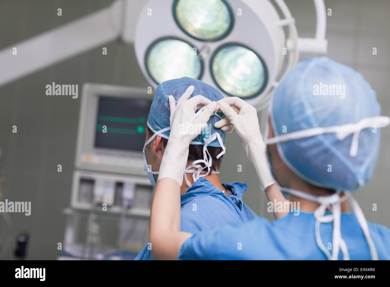 Nurse assisting a doctor Stock Photo - Alamy