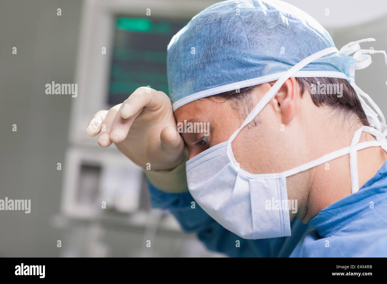 Doctor putting his hand on his forehead Stock Photo - Alamy