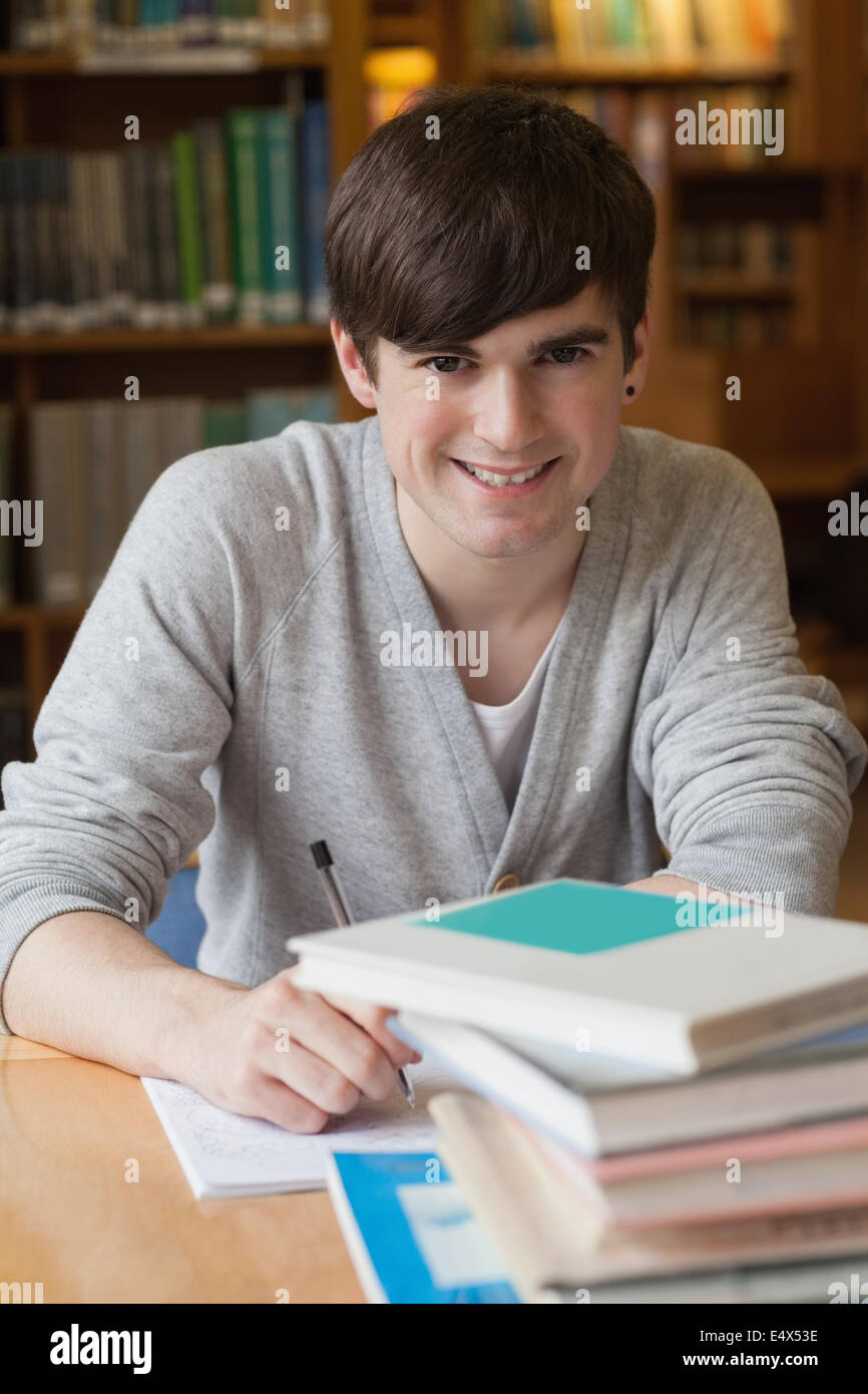Man sitting at library desk Stock Photo - Alamy
