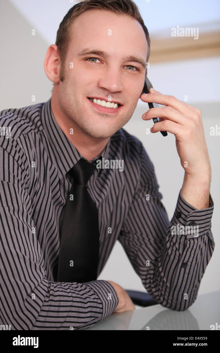 A business man talking on his smartphone Stock Photo - Alamy