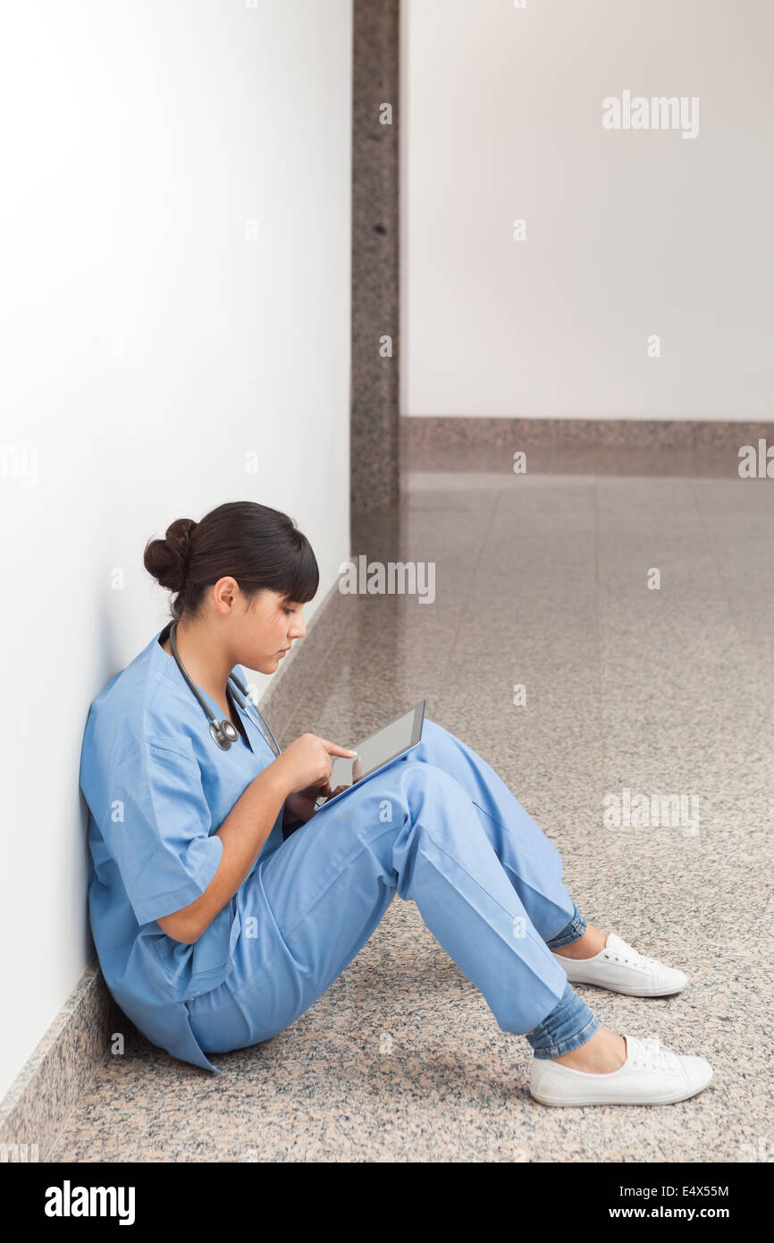 Nurse using computer tablet Stock Photo - Alamy