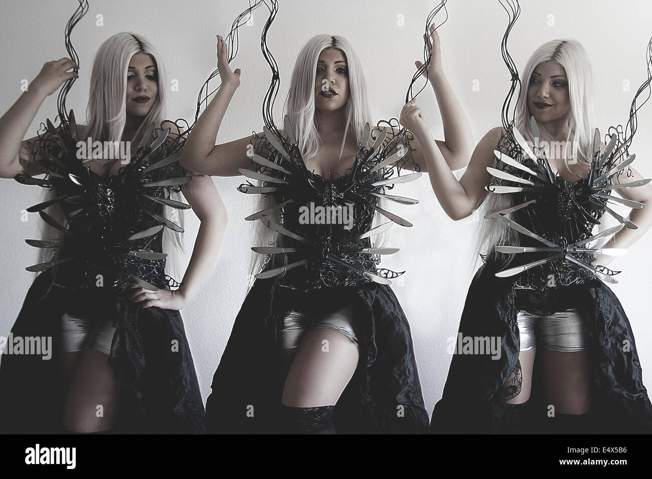 Three beautiful women, clones with gothic black dress Stock Photo - Alamy