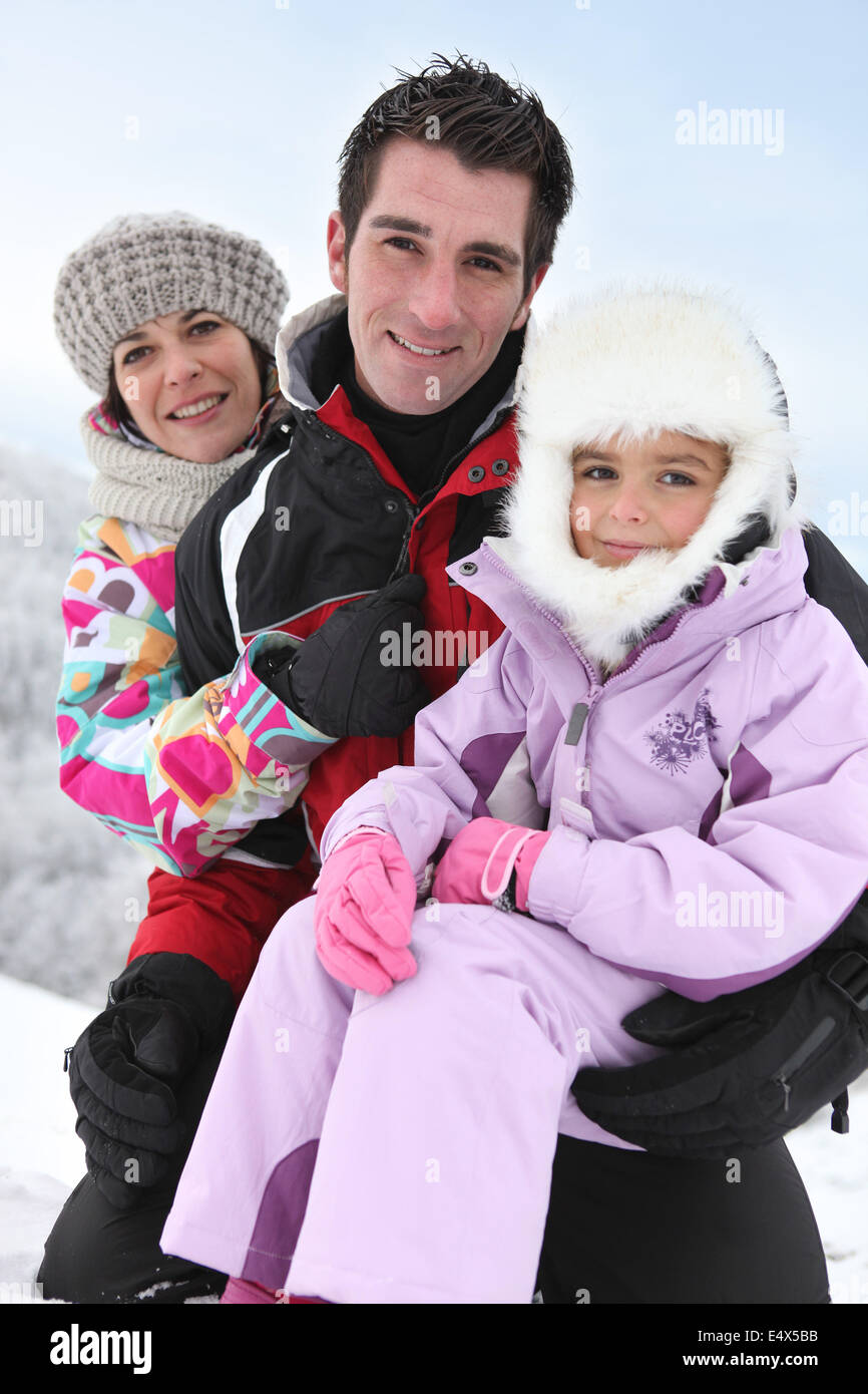 Family in the snow Stock Photo - Alamy