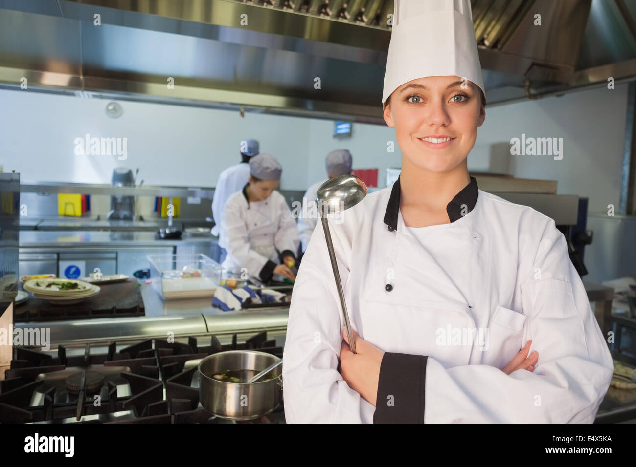 Chef holding ladle smiling hi-res stock photography and images - Alamy