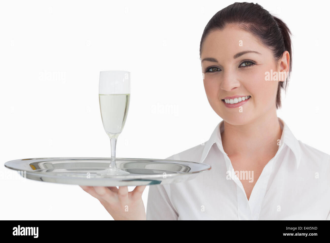 Woman carrying tray with glass of champagne Stock Photo - Alamy