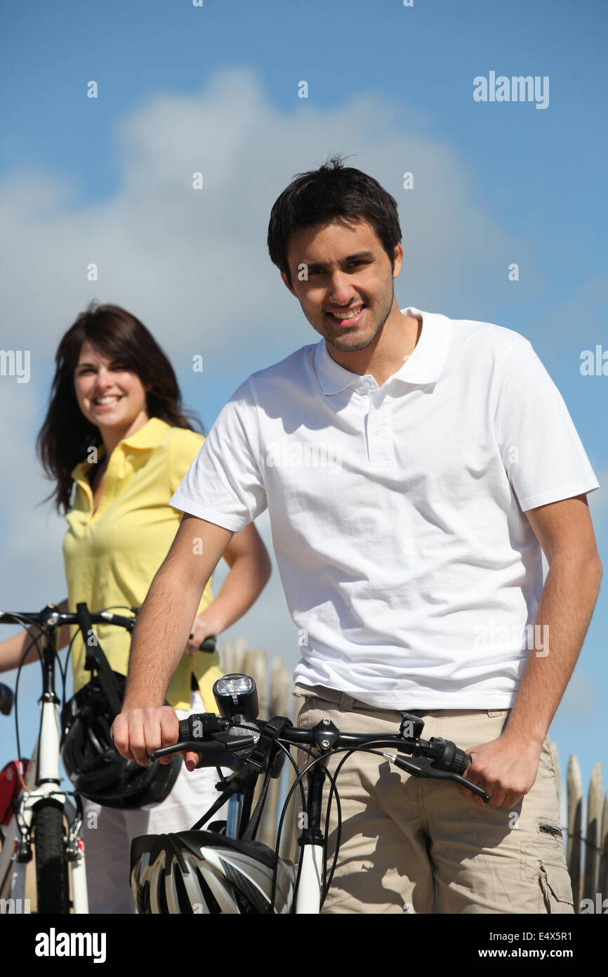Couple enjoying a bike ride together Stock Photo - Alamy