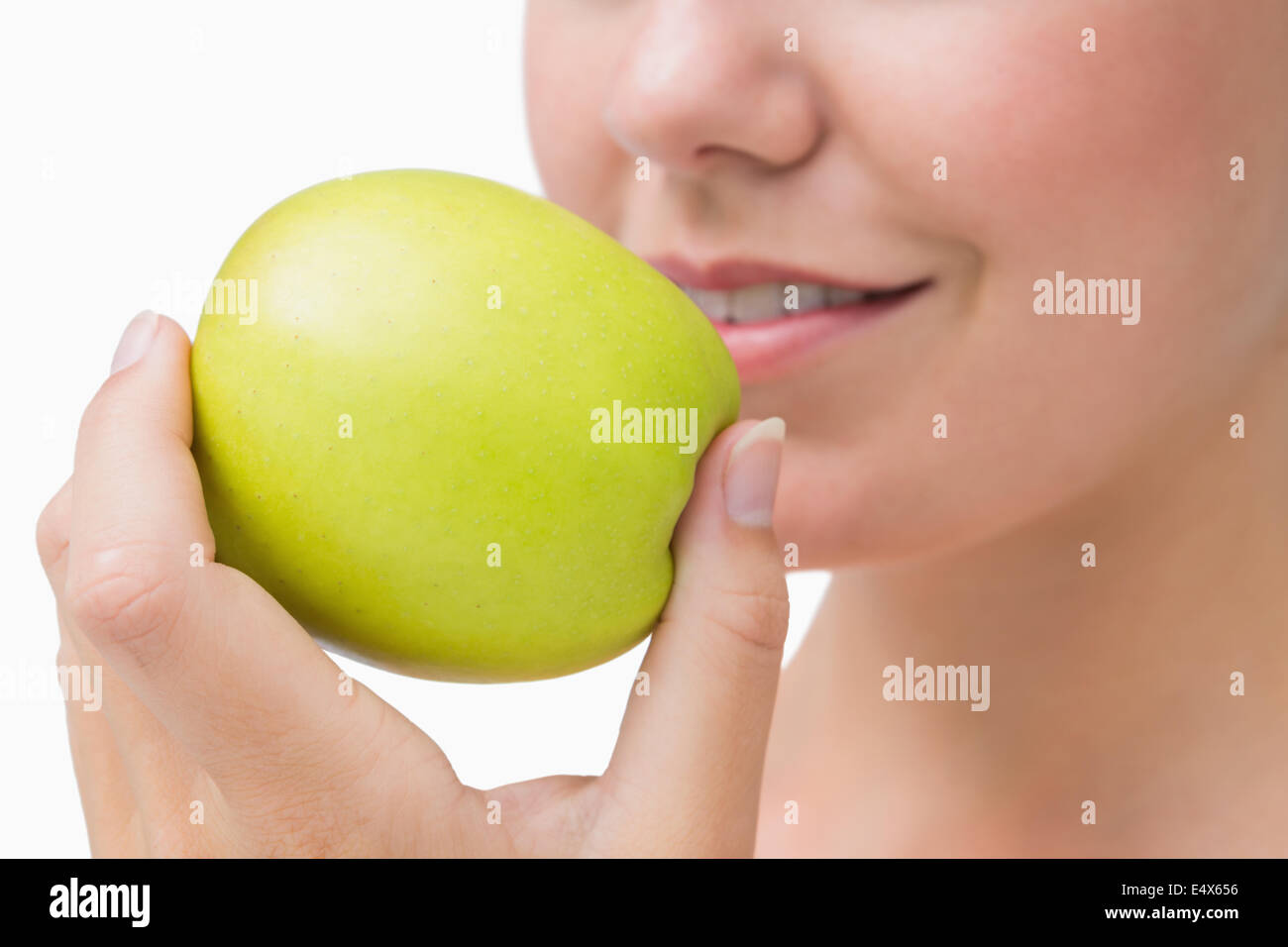 Woman about to eat apple Stock Photo - Alamy