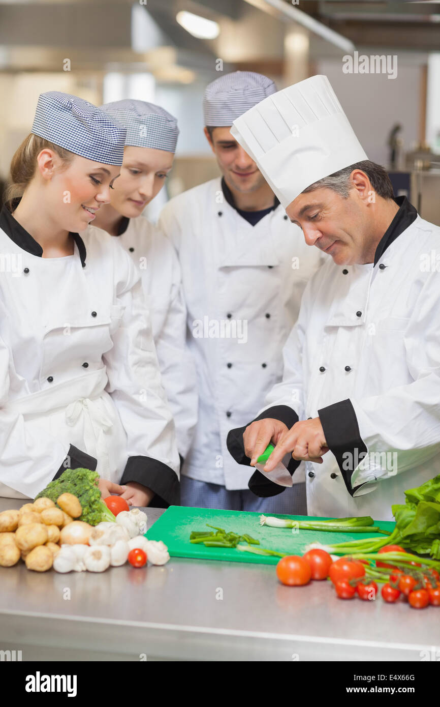 Chef teaching trainees how to cut vegetables Stock Photo - Alamy