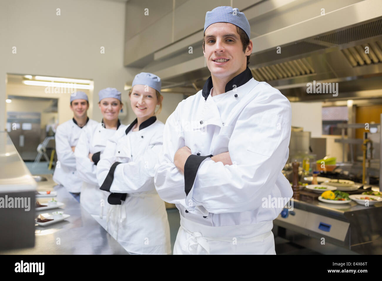 Team of Chef's in kitchen Stock Photo - Alamy