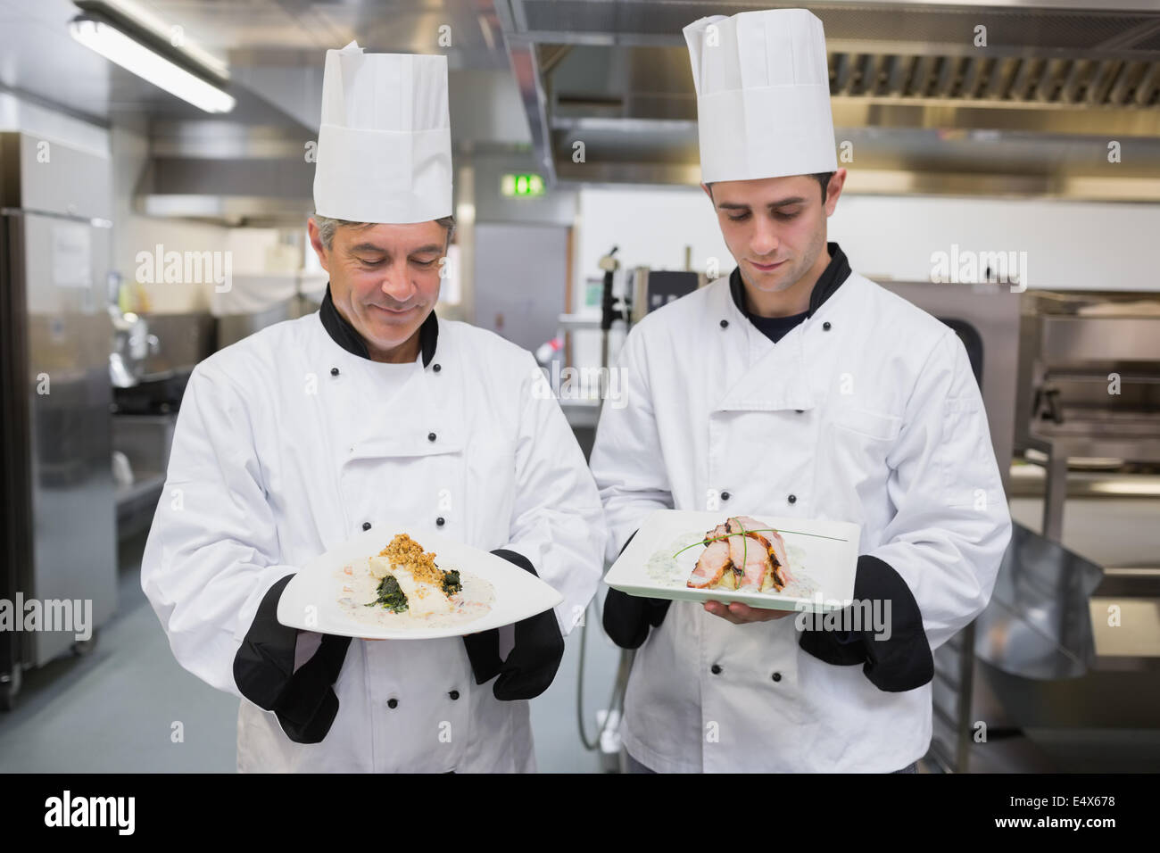 Two chefs presenting dishes hi-res stock photography and images - Alamy