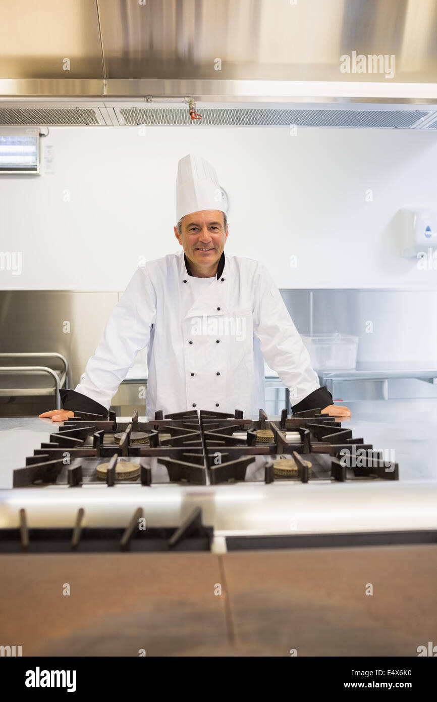 Man standing at the stove Stock Photo - Alamy