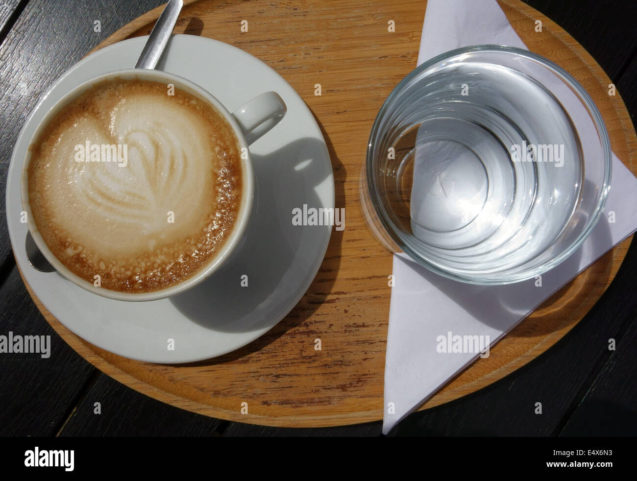 Cup of coffee and glass of water in cafe, England Stock Photo - Alamy
