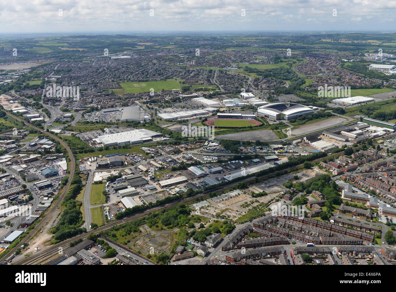 An aerial view of Wigan showing industrial areas and the JJB Stadium ...
