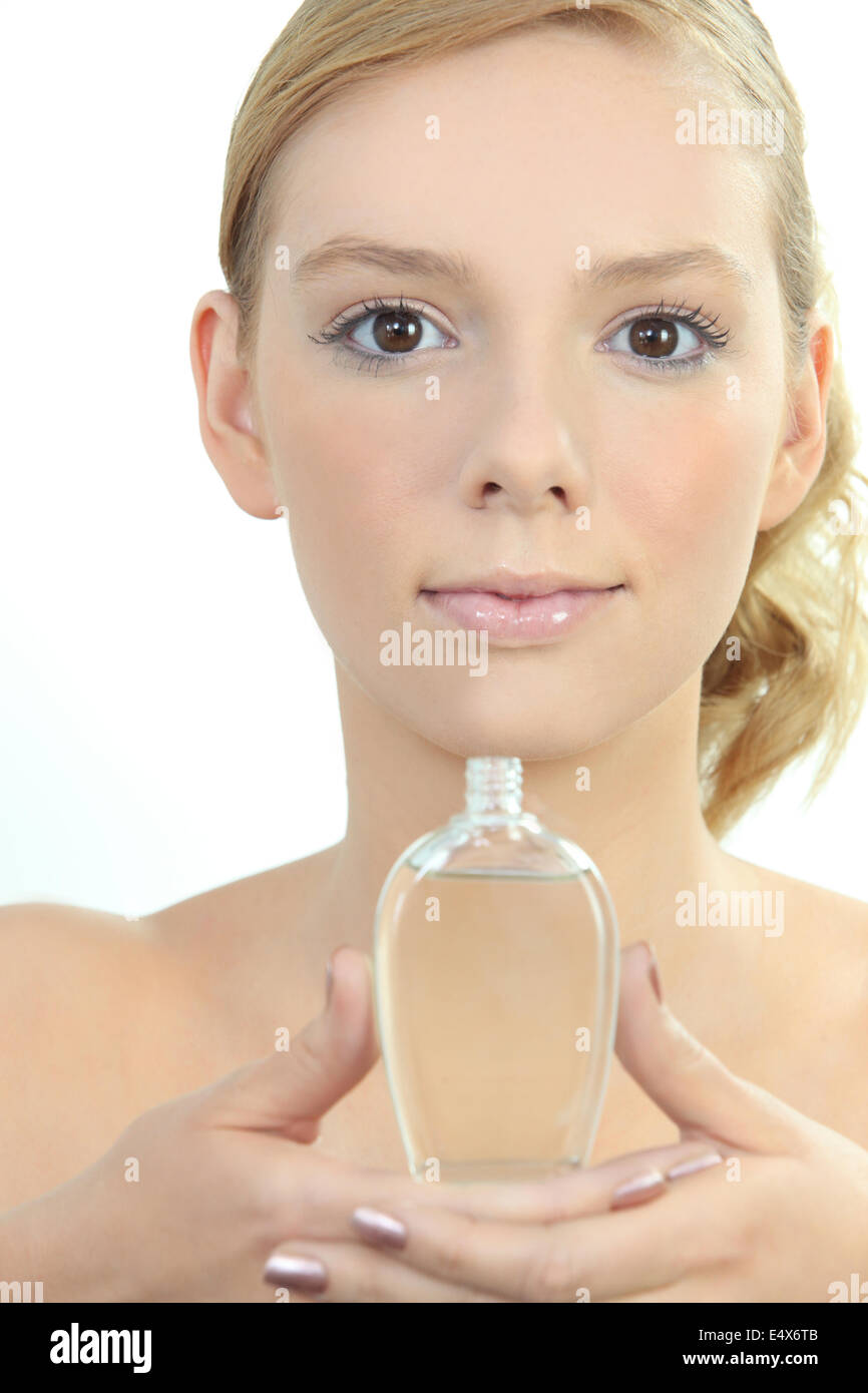 Woman with perfume bottle Stock Photo - Alamy