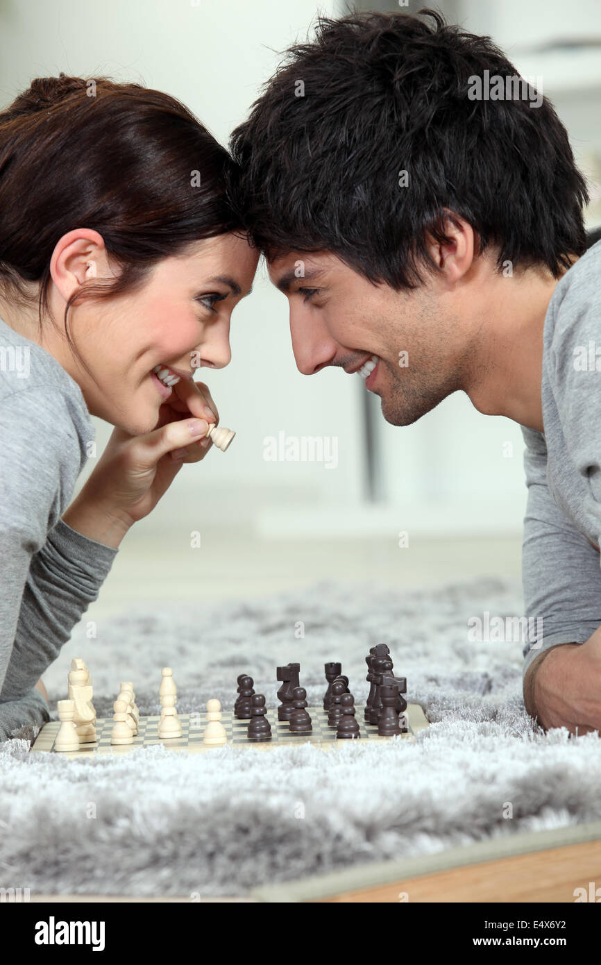 Couple playing chess Stock Photo - Alamy