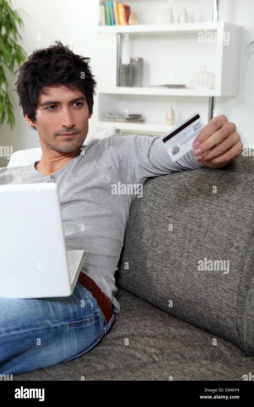 Man using his credit card online Stock Photo - Alamy Man using his credit card online Stock Photo - Alamy