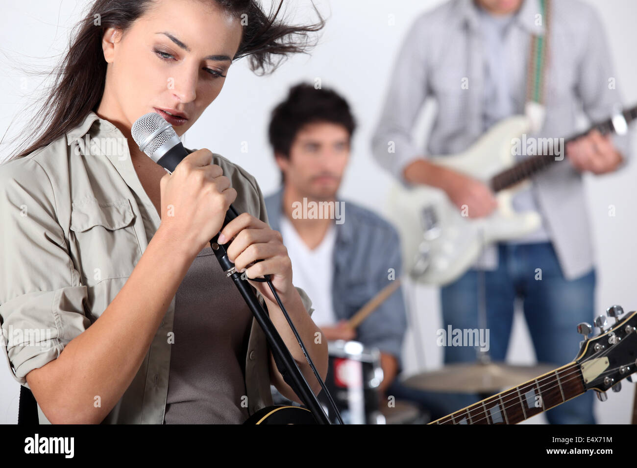 Woman playing musical instruments hi-res stock photography and images ...