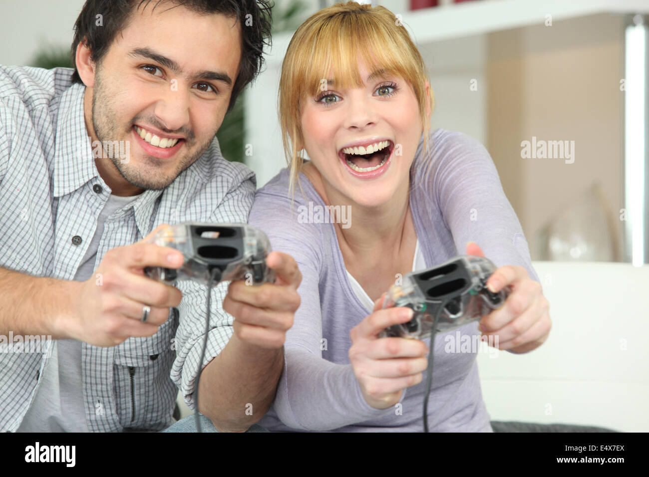 Couple playing video games Stock Photo - Alamy