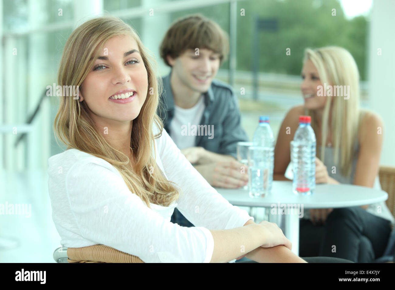 portrait of teenagers at table Stock Photo - Alamy