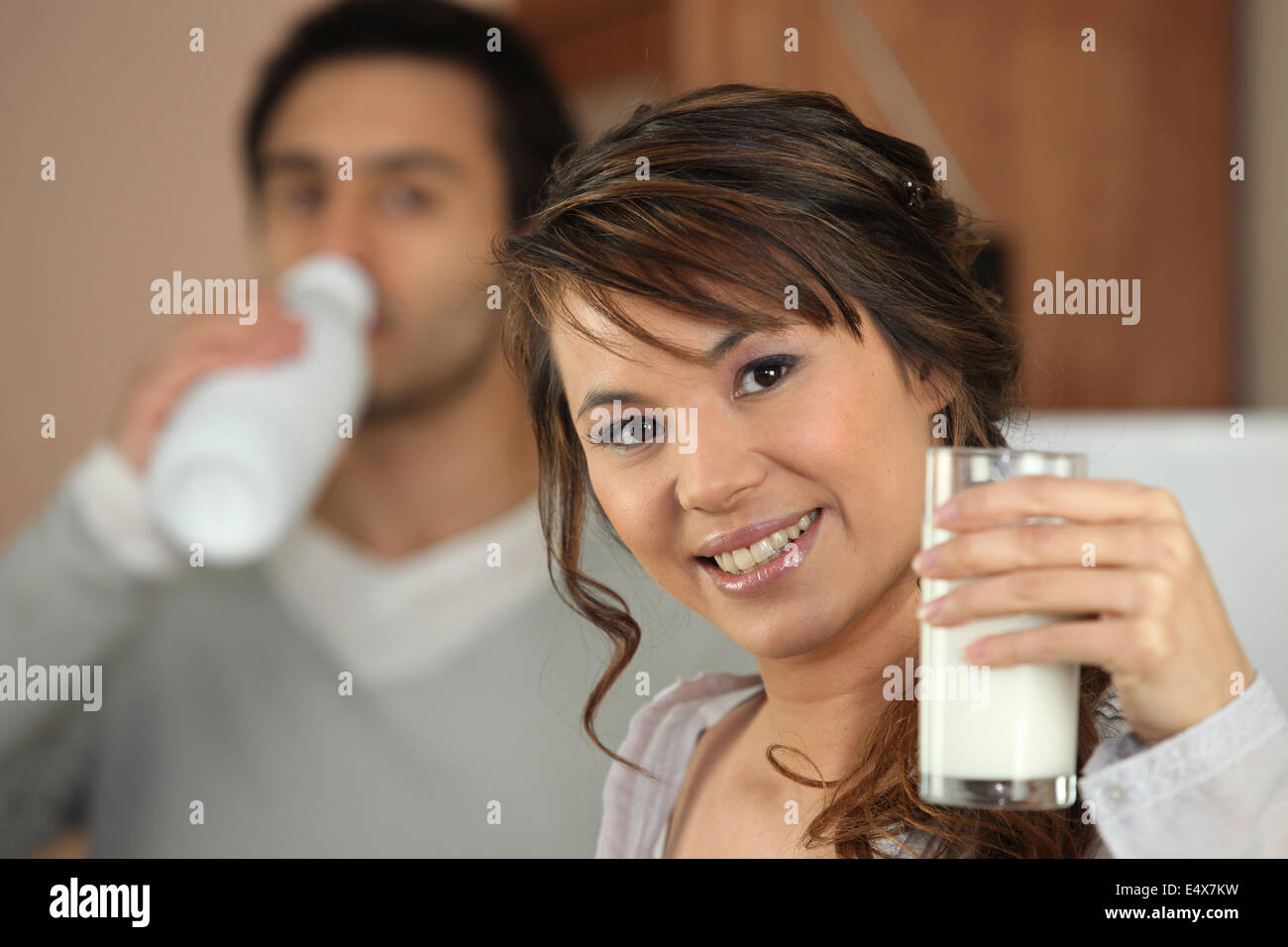 Couple drinking milk Stock Photo - Alamy