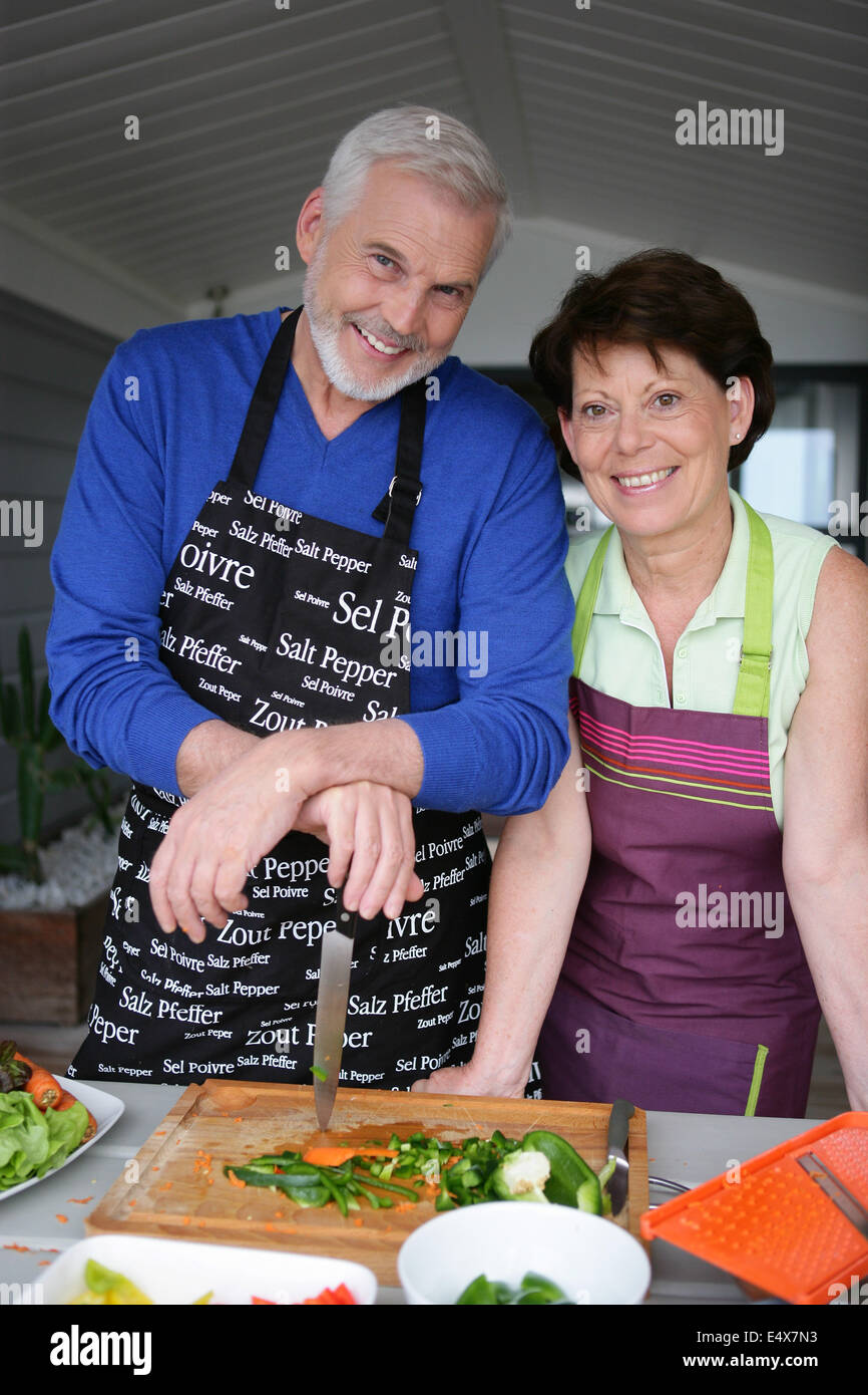 Family preparing outdoor dinner hi-res stock photography and images - Alamy