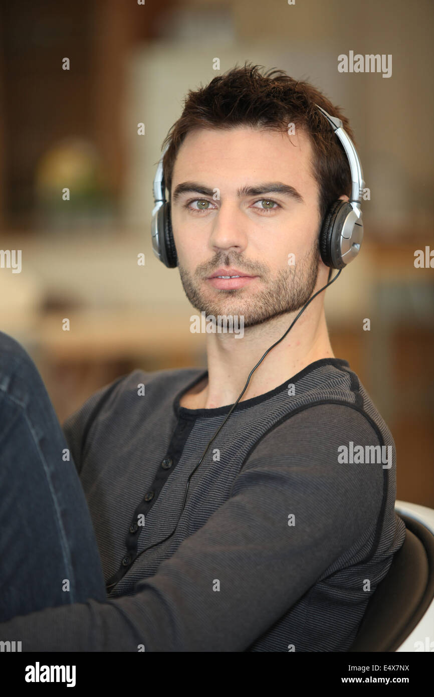 Single man with headphones Stock Photo - Alamy