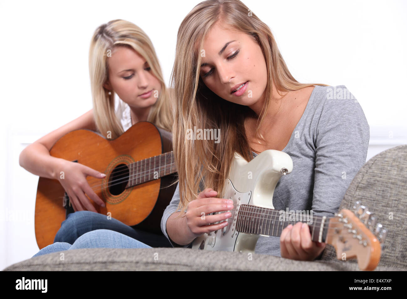 Women playing the guitar Stock Photo - Alamy