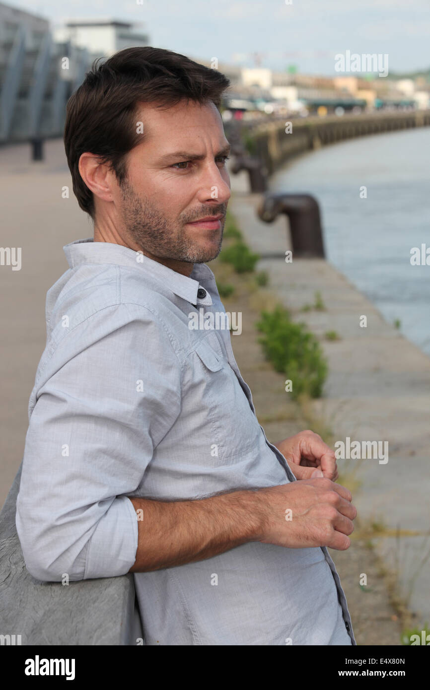 Man looking at river Stock Photo - Alamy