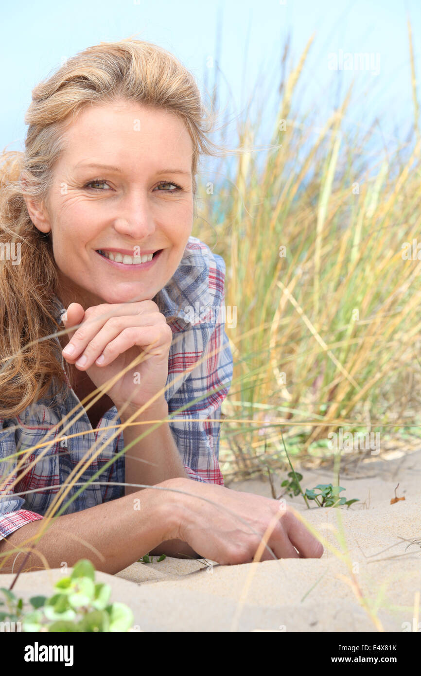 Smiling woman on seaside hi-res stock photography and images - Alamy