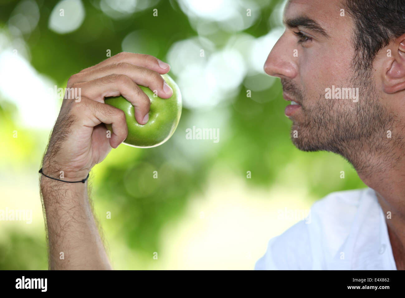 Man holding up apple hi-res stock photography and images - Alamy