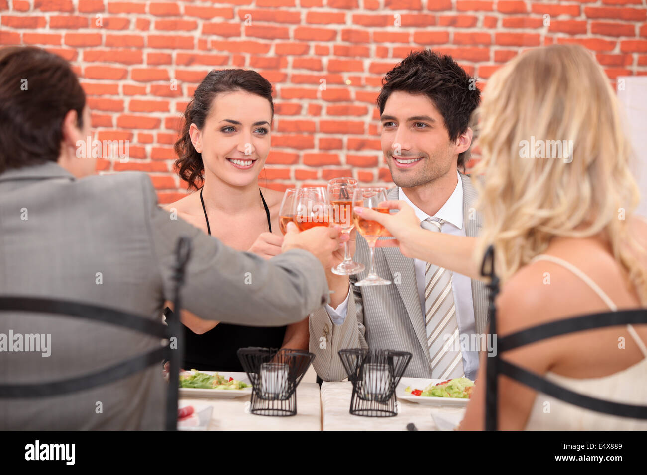 Young friends having dinner hi-res stock photography and images - Alamy