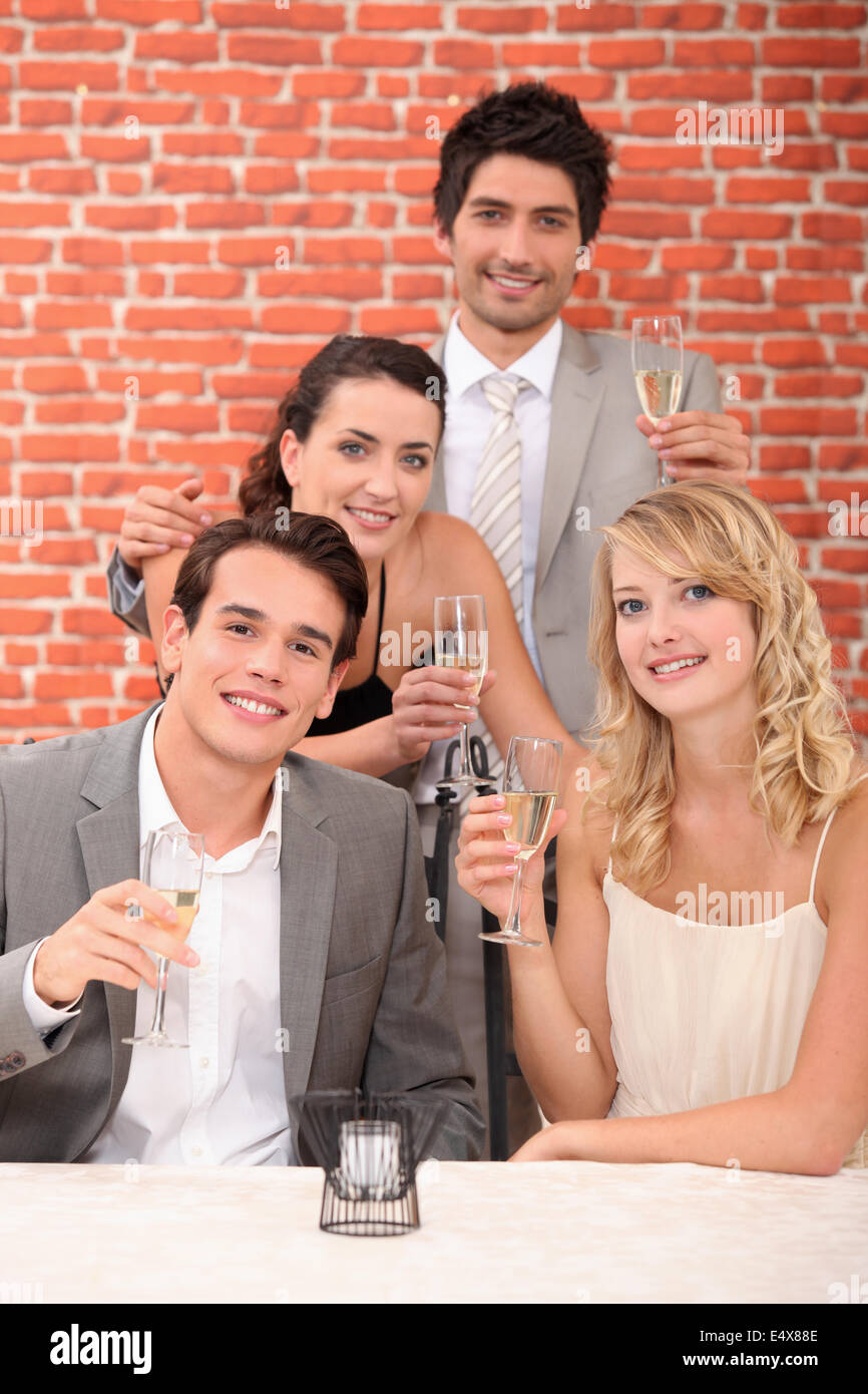 friends at table Stock Photo - Alamy