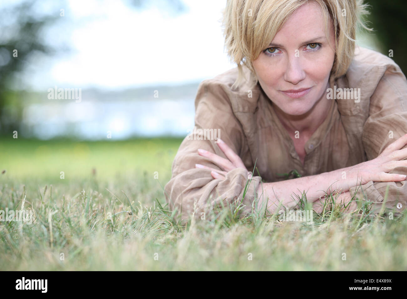 Teen girl lying on field hi-res stock photography and images - Alamy
