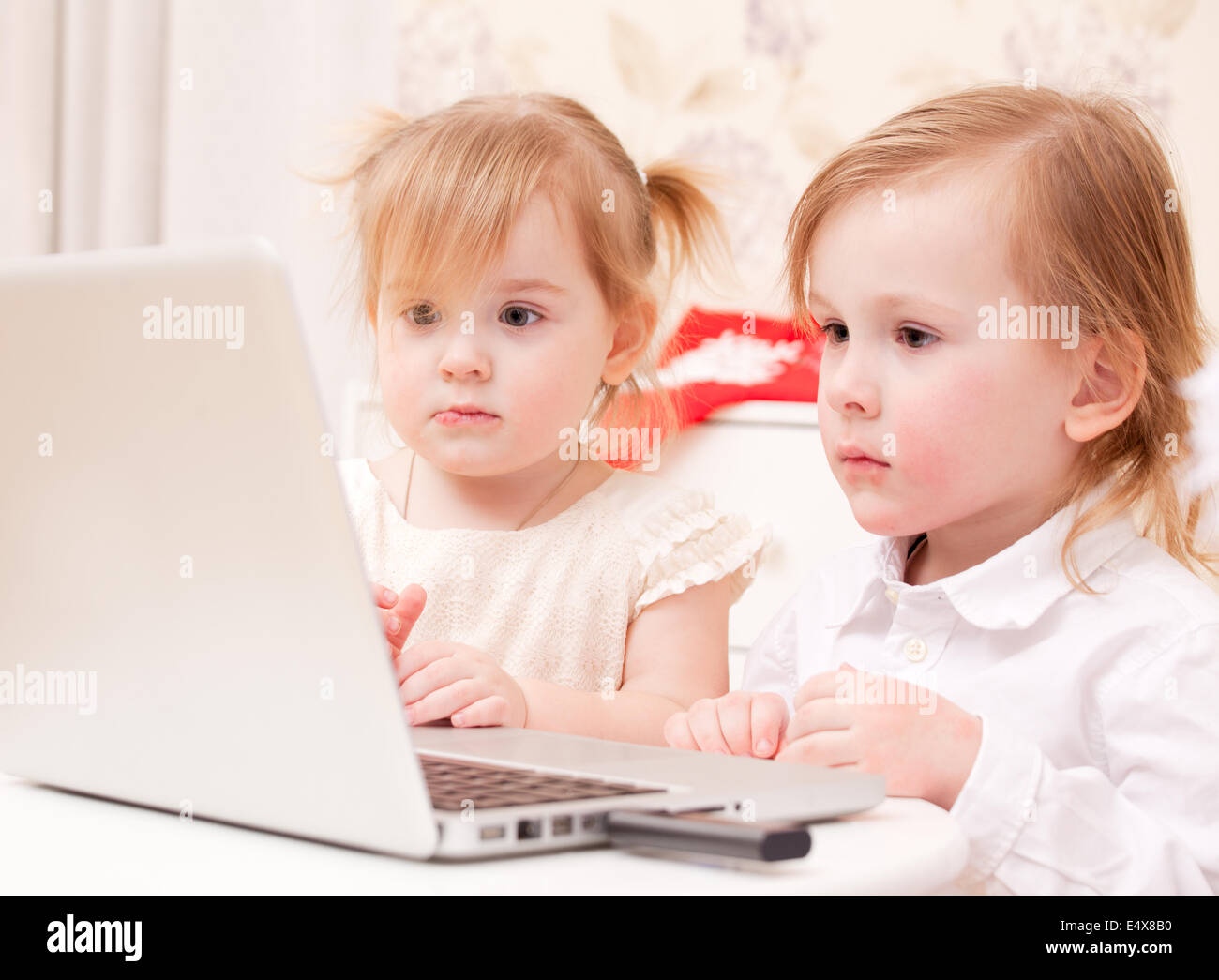 Children with laptop indoors Stock Photo - Alamy