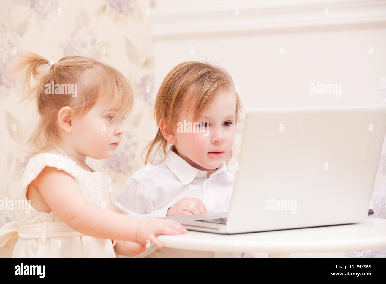 Children with laptop indoors Stock Photo - Alamy