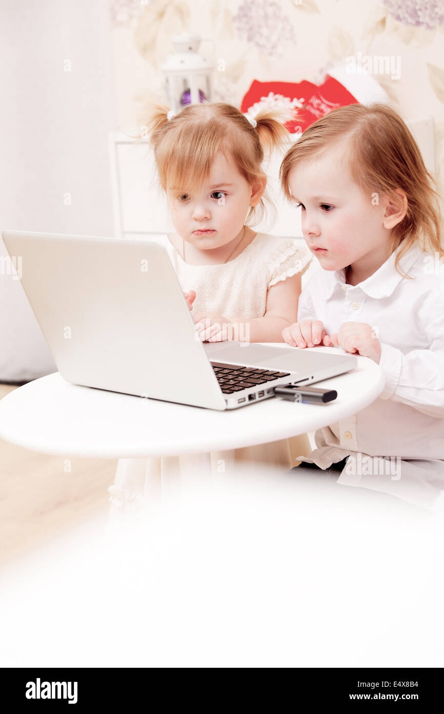 Children with laptop indoors Stock Photo - Alamy
