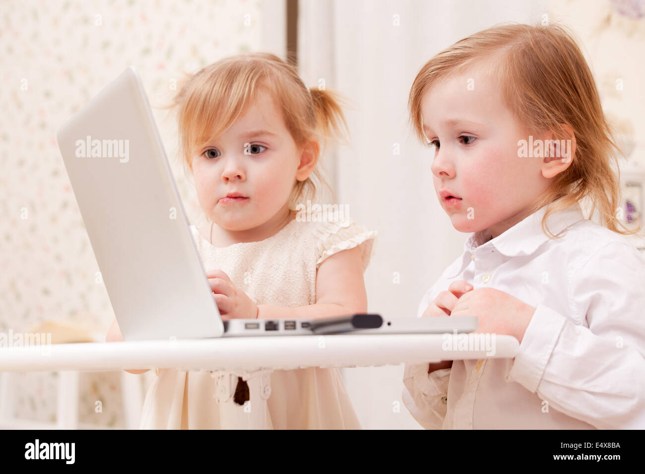 Children with laptop indoors Stock Photo - Alamy