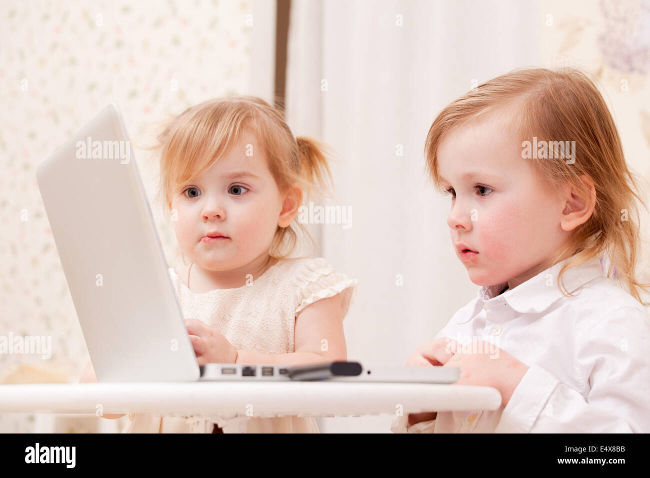 Children with laptop indoors Stock Photo - Alamy