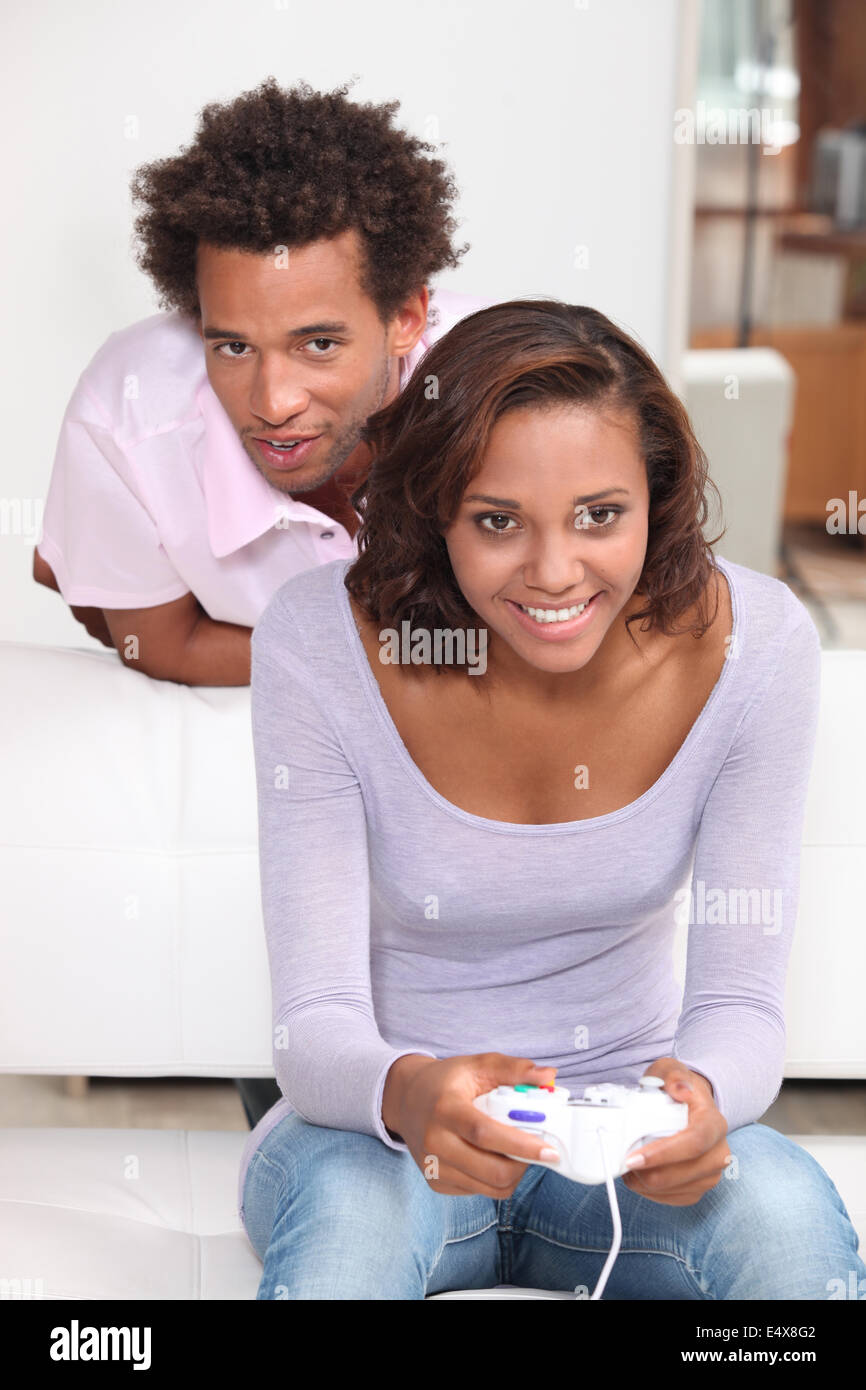 Couple on games console Stock Photo - Alamy