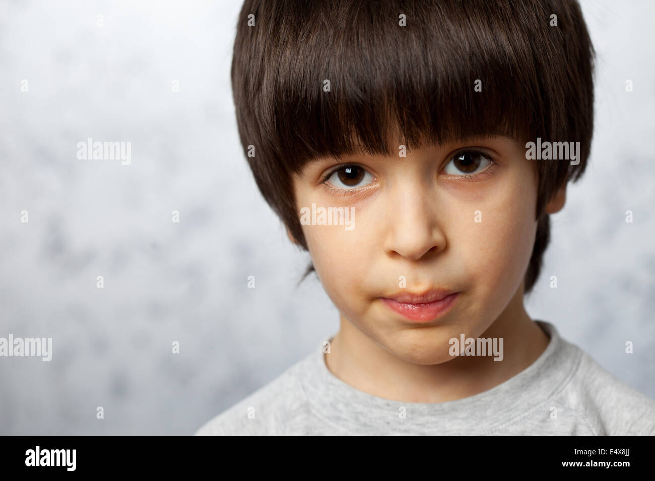 portrait of a stubborn boy Stock Photo - Alamy