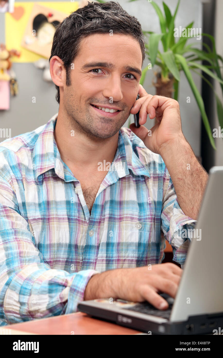 Man with computer at home Stock Photo - Alamy