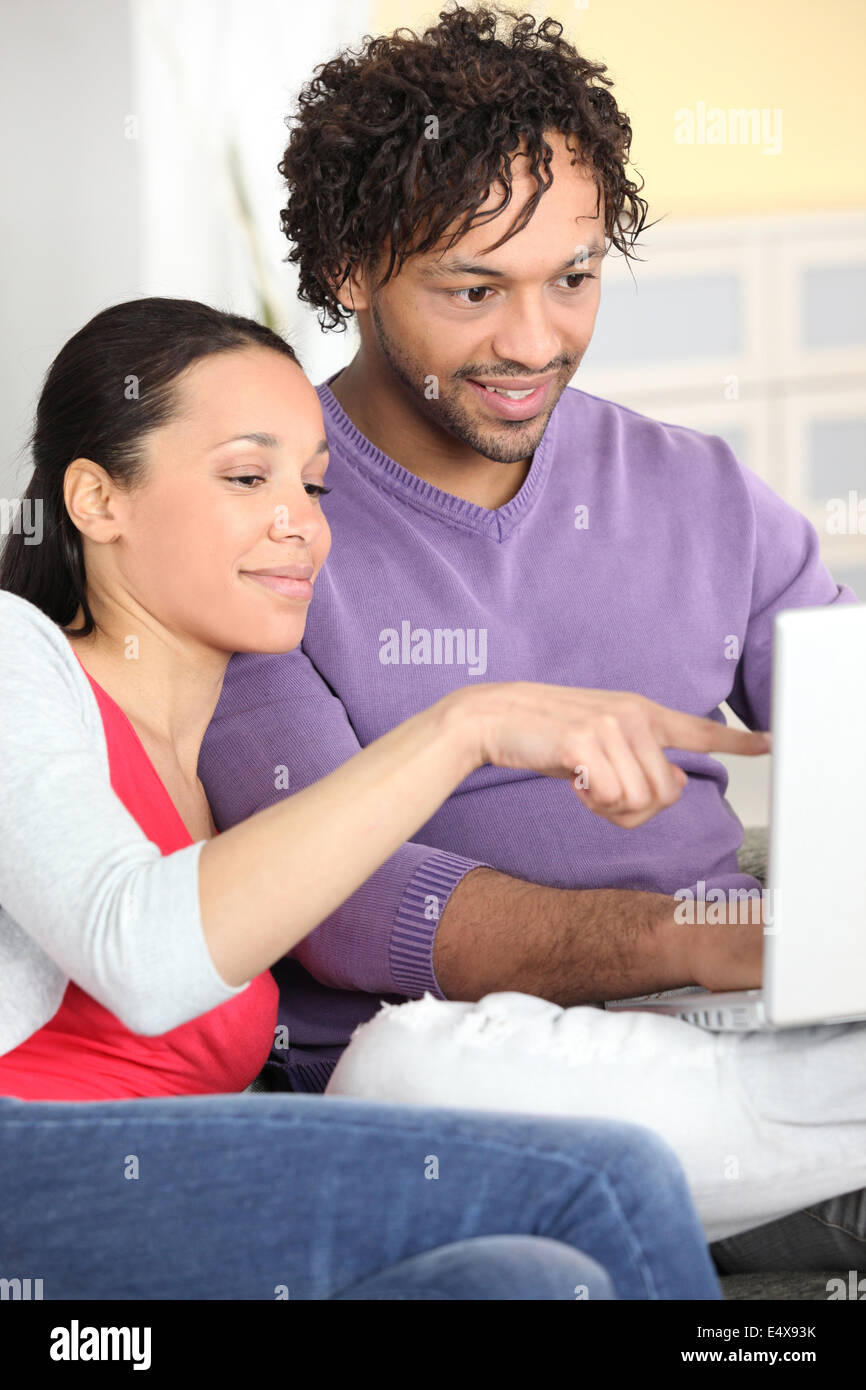 Couple happily browsing the internet Stock Photo - Alamy