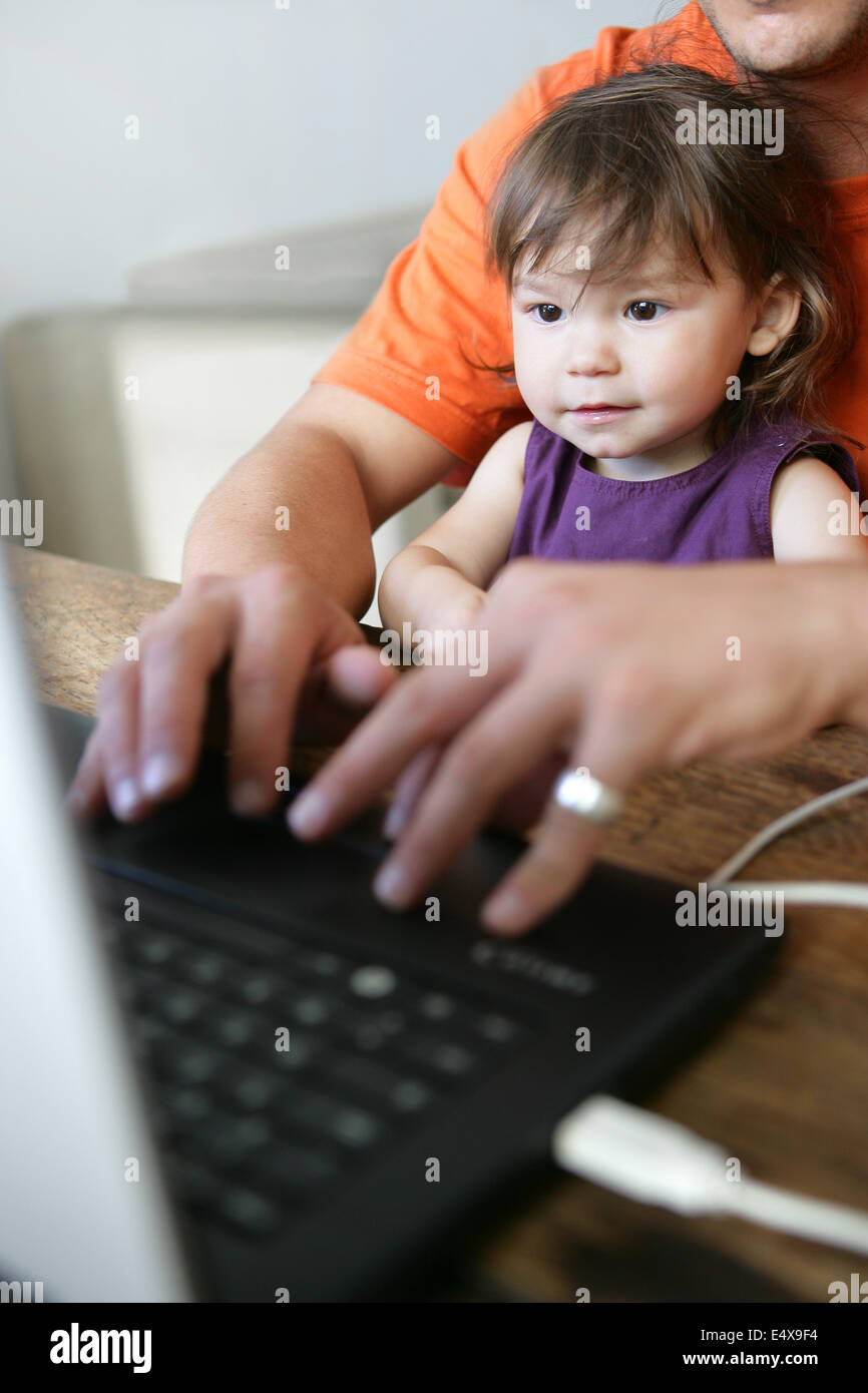 Father and daughter using computer Stock Photo - Alamy