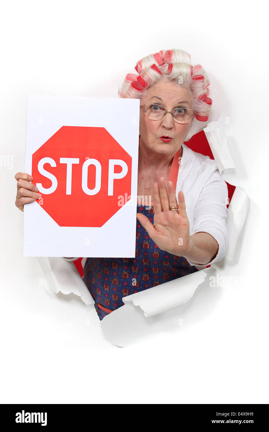 An old lady with a stop sign Stock Photo - Alamy